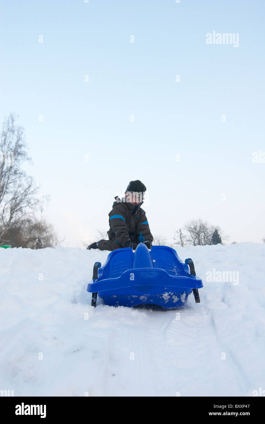 Children sledding on sled winter Stock Photo - Alamy
