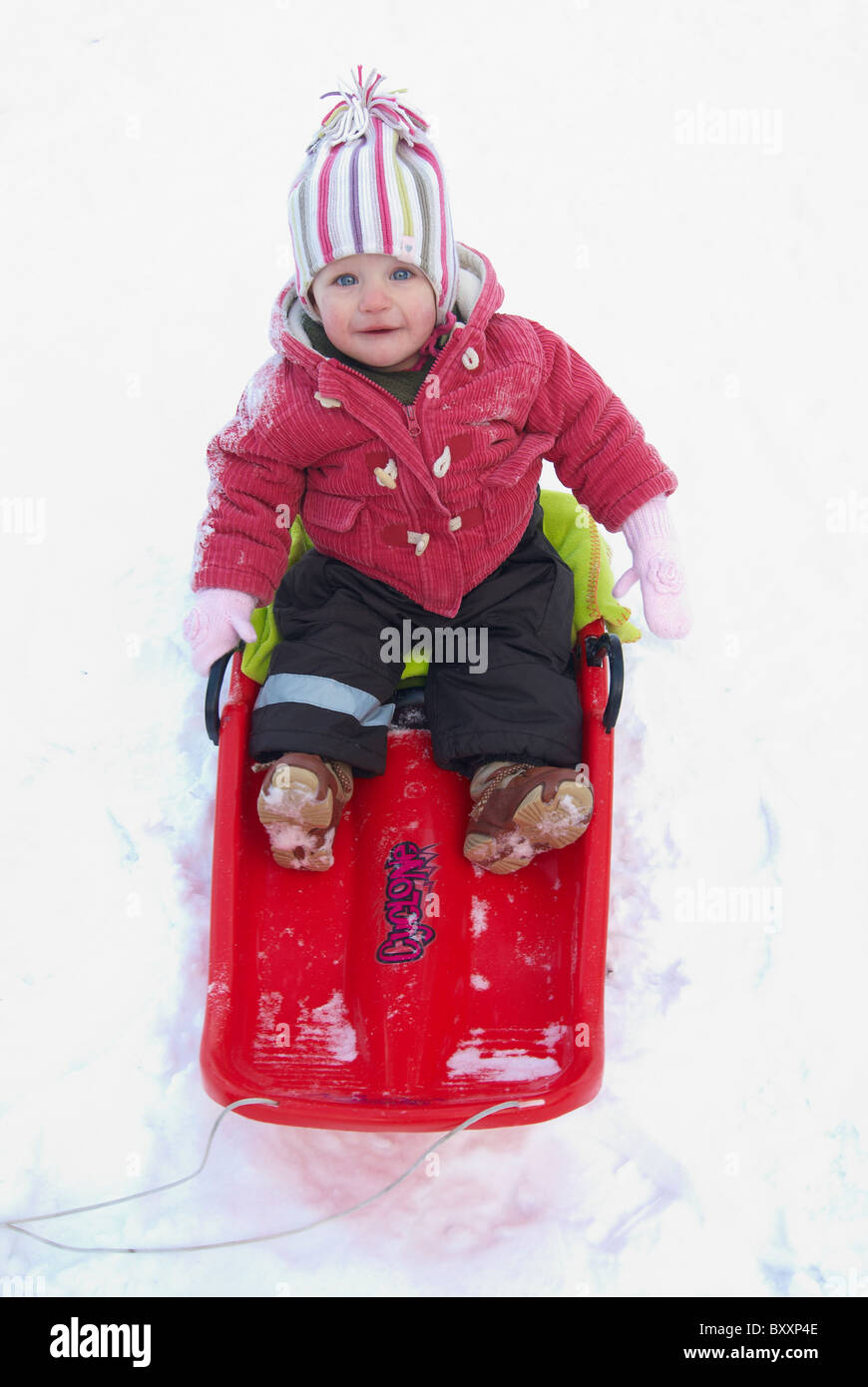 Children sledding on sled winter Stock Photo - Alamy