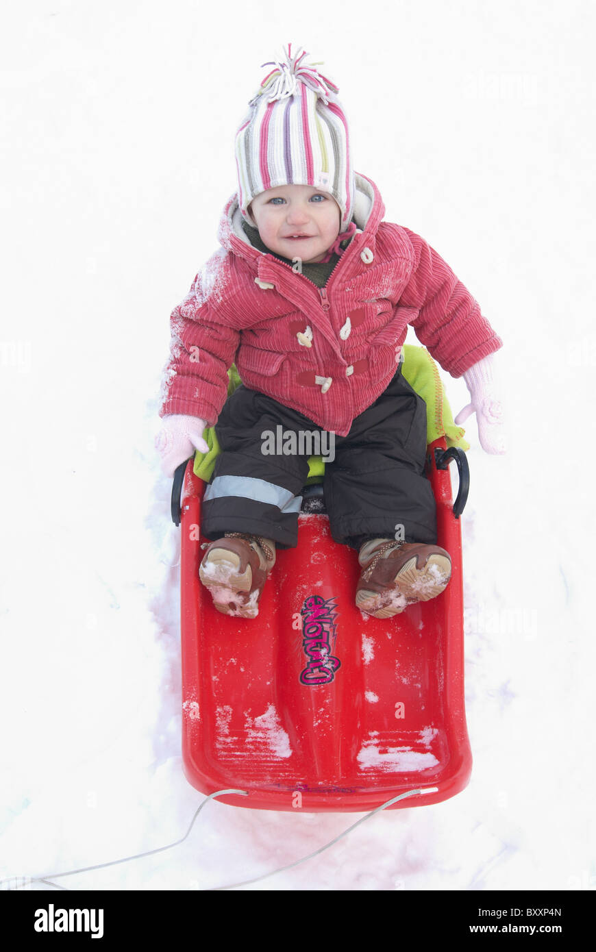 Children sledding on sled winter Stock Photo - Alamy