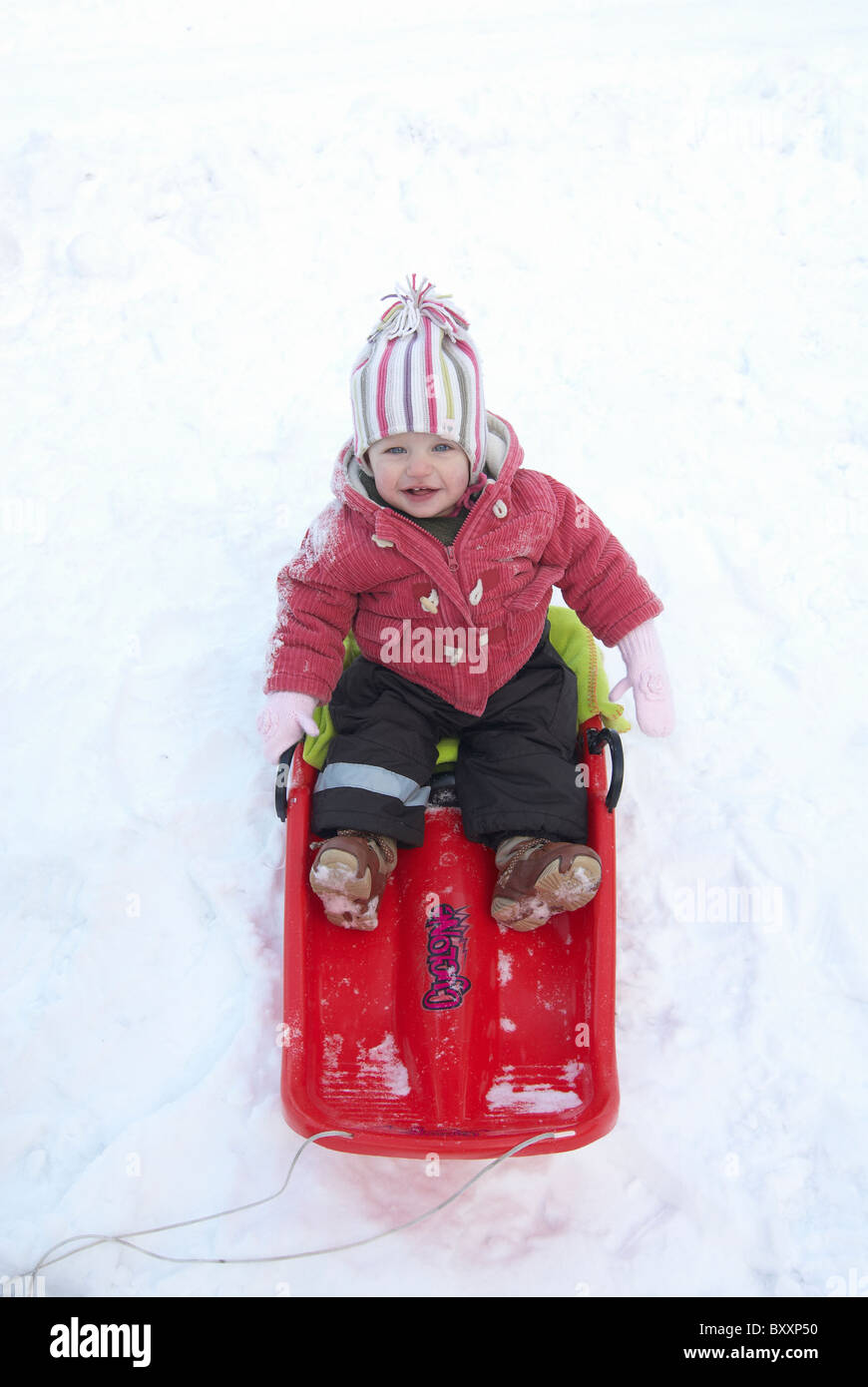 Children sledding on sled winter Stock Photo - Alamy