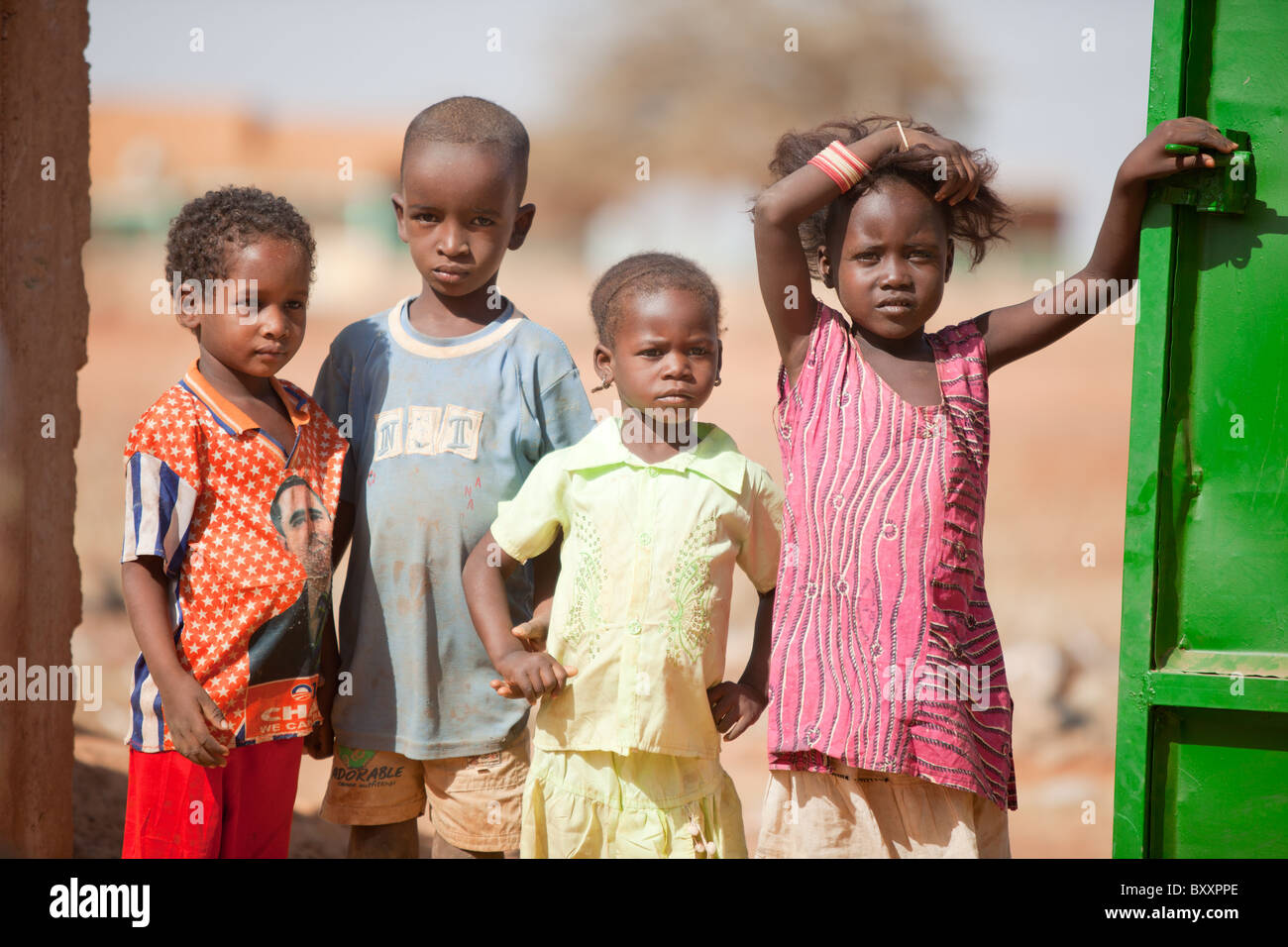 Fulani children in the town of Djibo in northern Burkina Faso. One girl ...