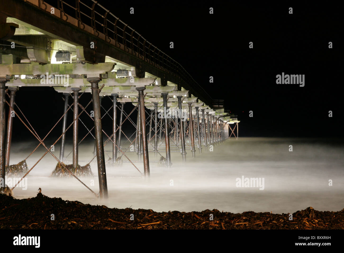 A view of Saltburn Pier at night with underside lighting illuminating ...