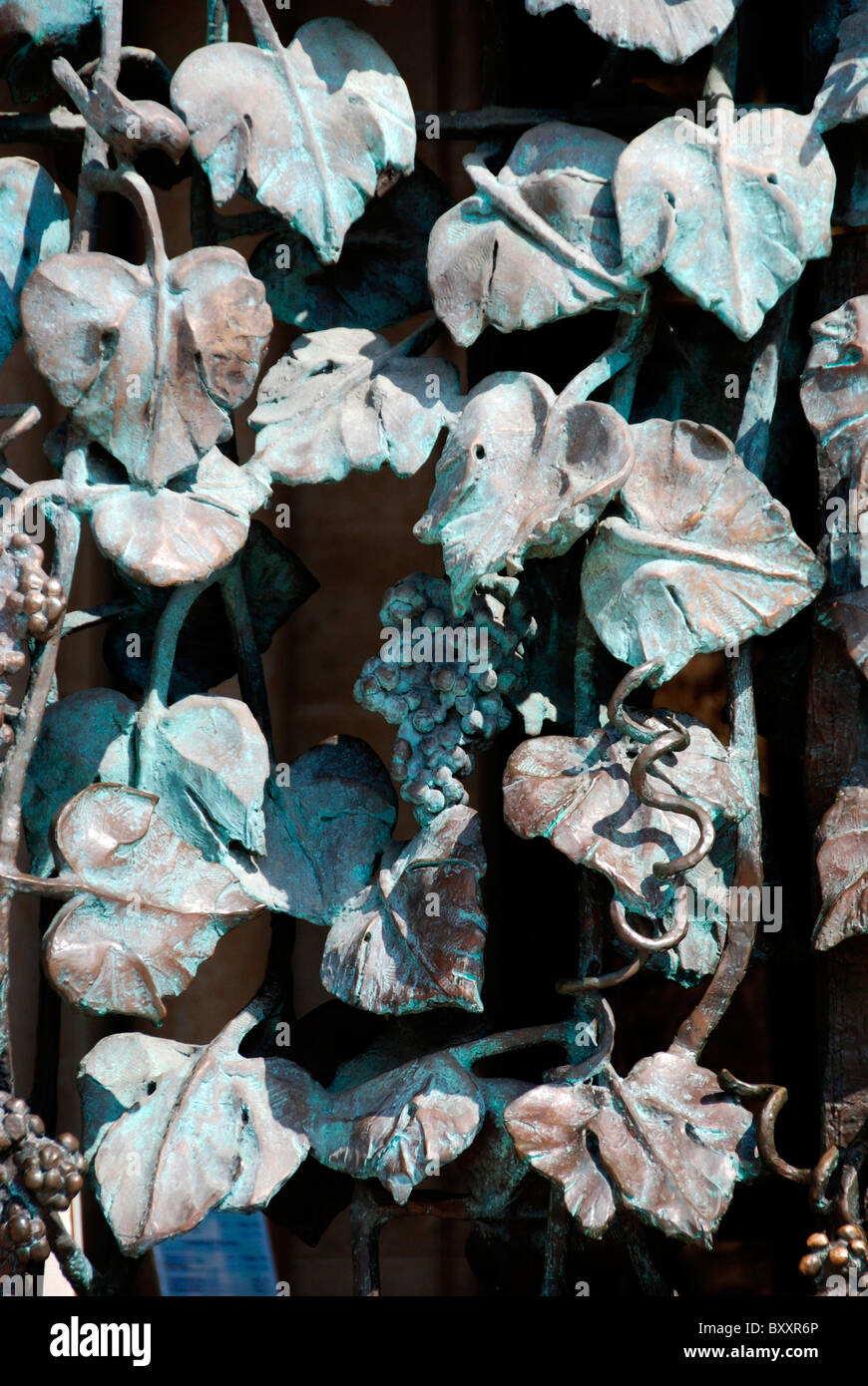 Detail of bronze grape vine gate on the side entrance of Sts. Peter and ...