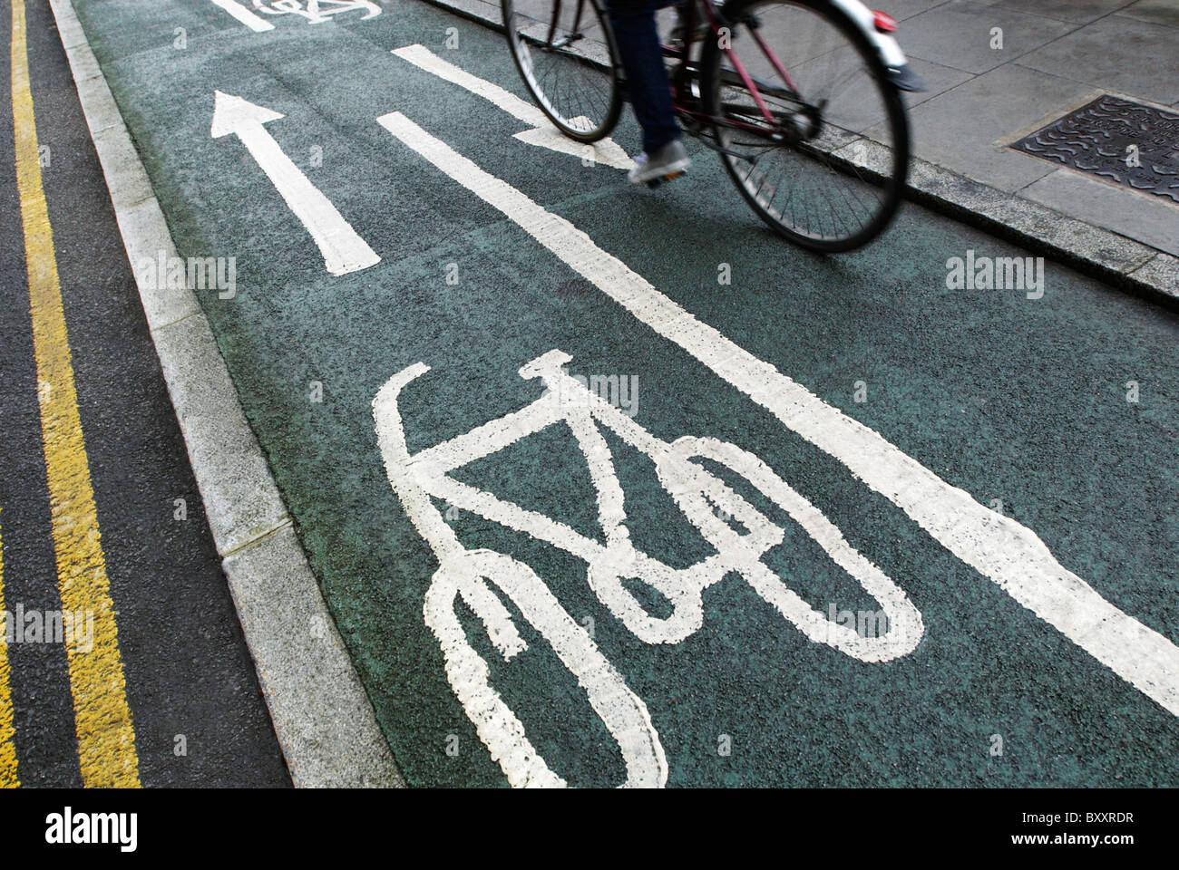 Cylist on two-way cycle lane UK elevated view Stock Photo - Alamy