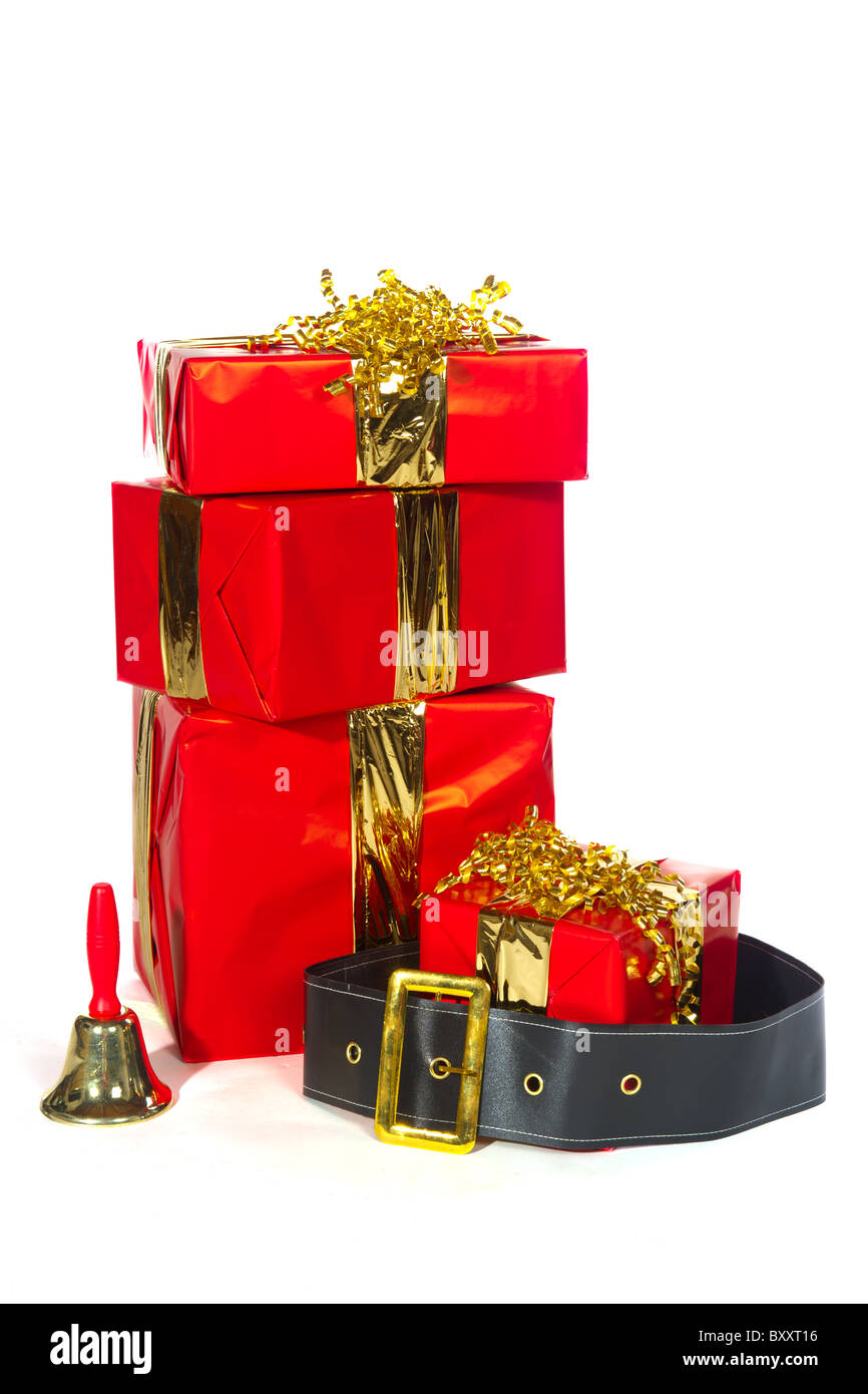 Christmas presents in red and gold with cloths from Santa Claus Stock ...