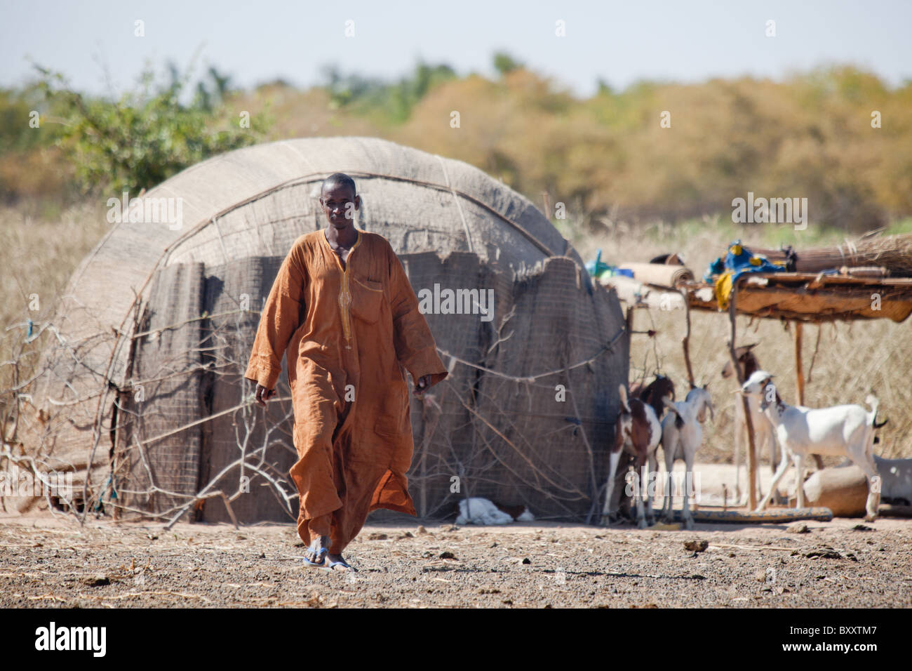 African man and hut hi-res stock photography and images - Alamy