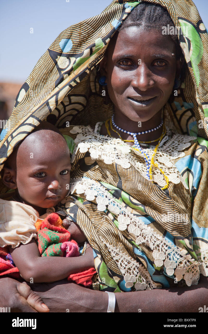 Fulani woman and child at the village market of Bourro in northern ...