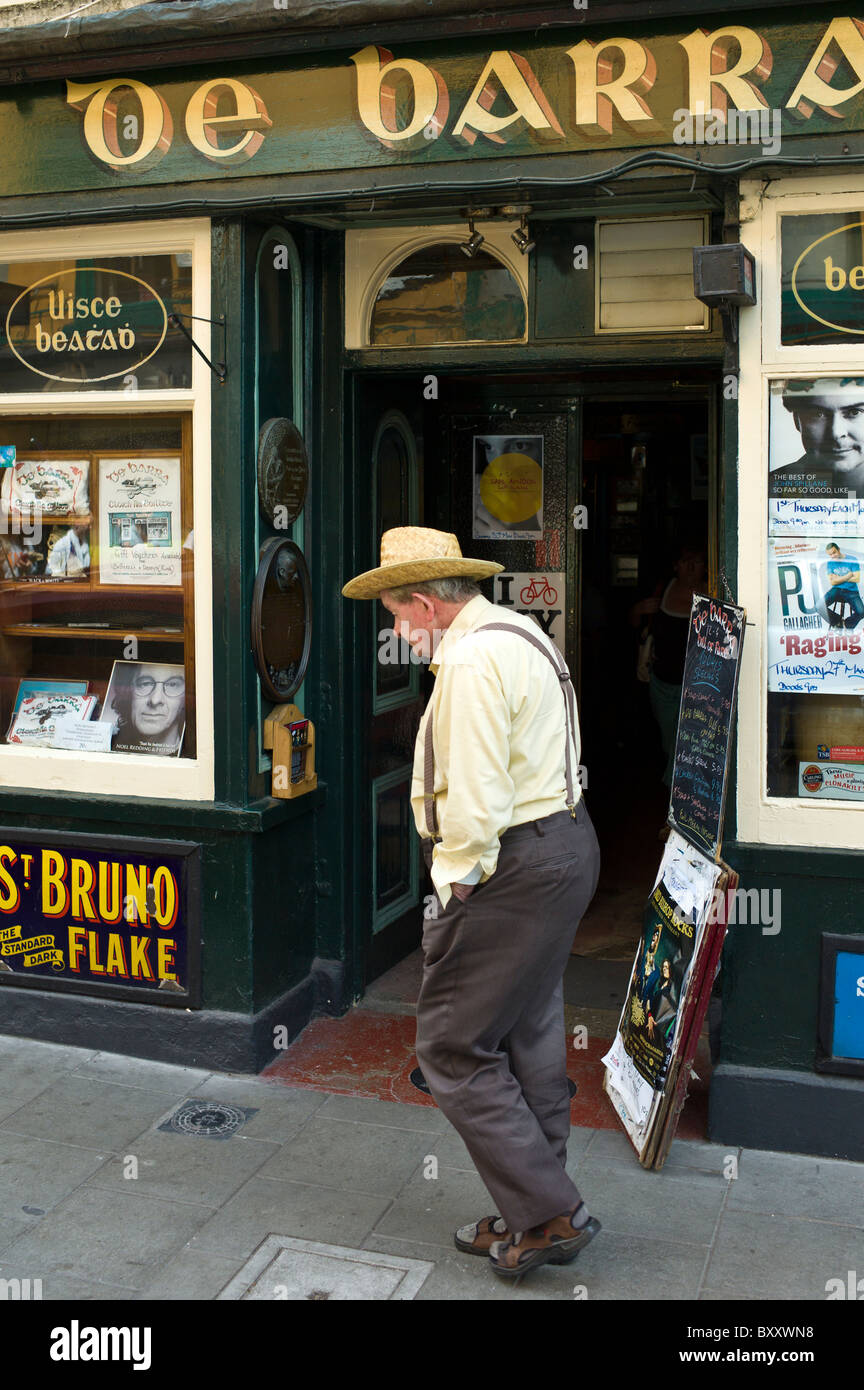 Man walking past de Barra bar in Timoleague, West Cork, Ireland Stock ...