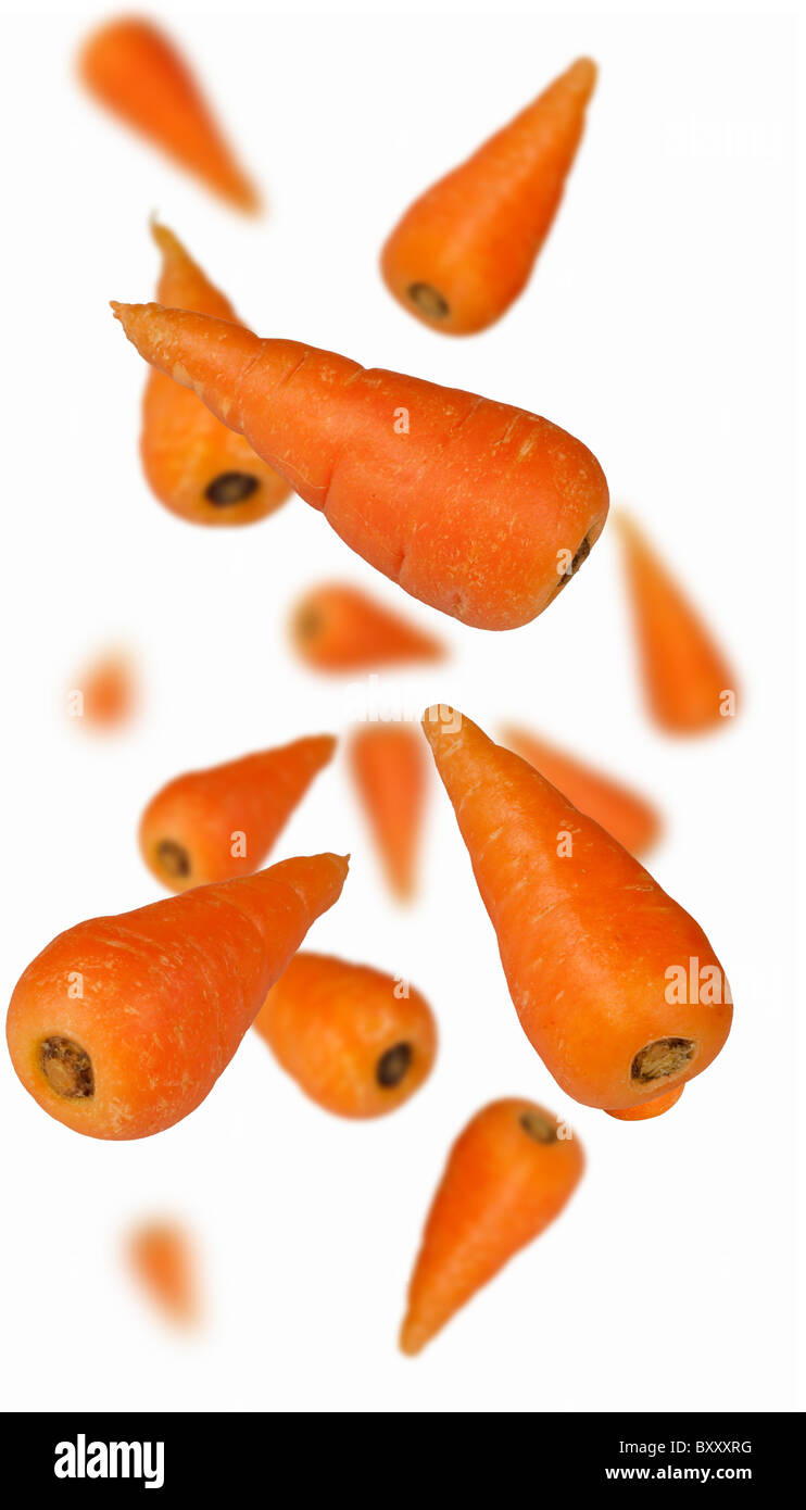 falling carrots shot with blur to simulate depth of field Stock Photo ...