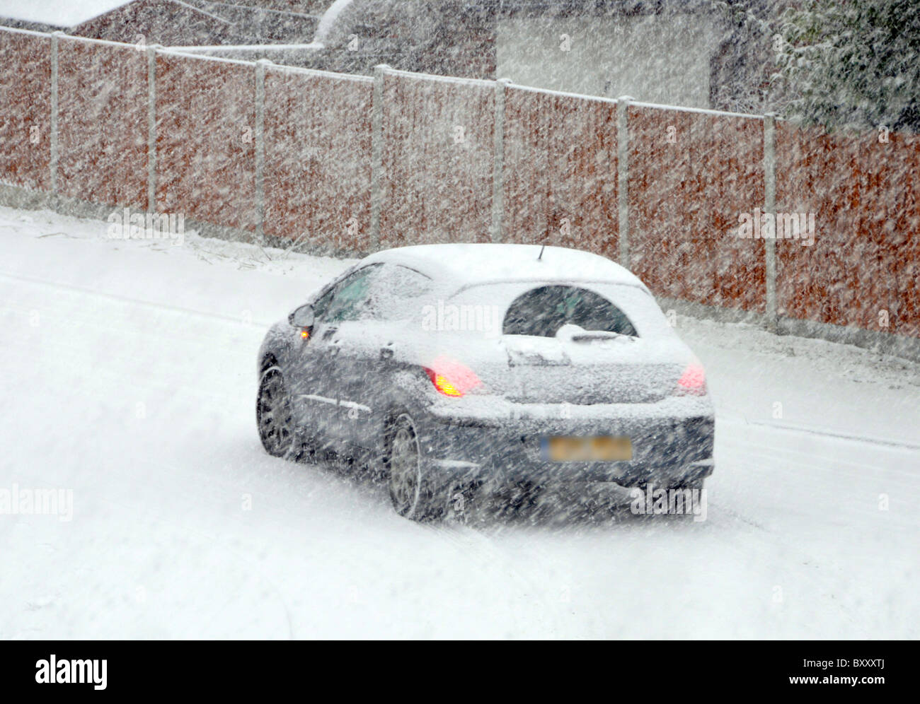 Driving car in snow blizzard Stock Photo - Alamy
