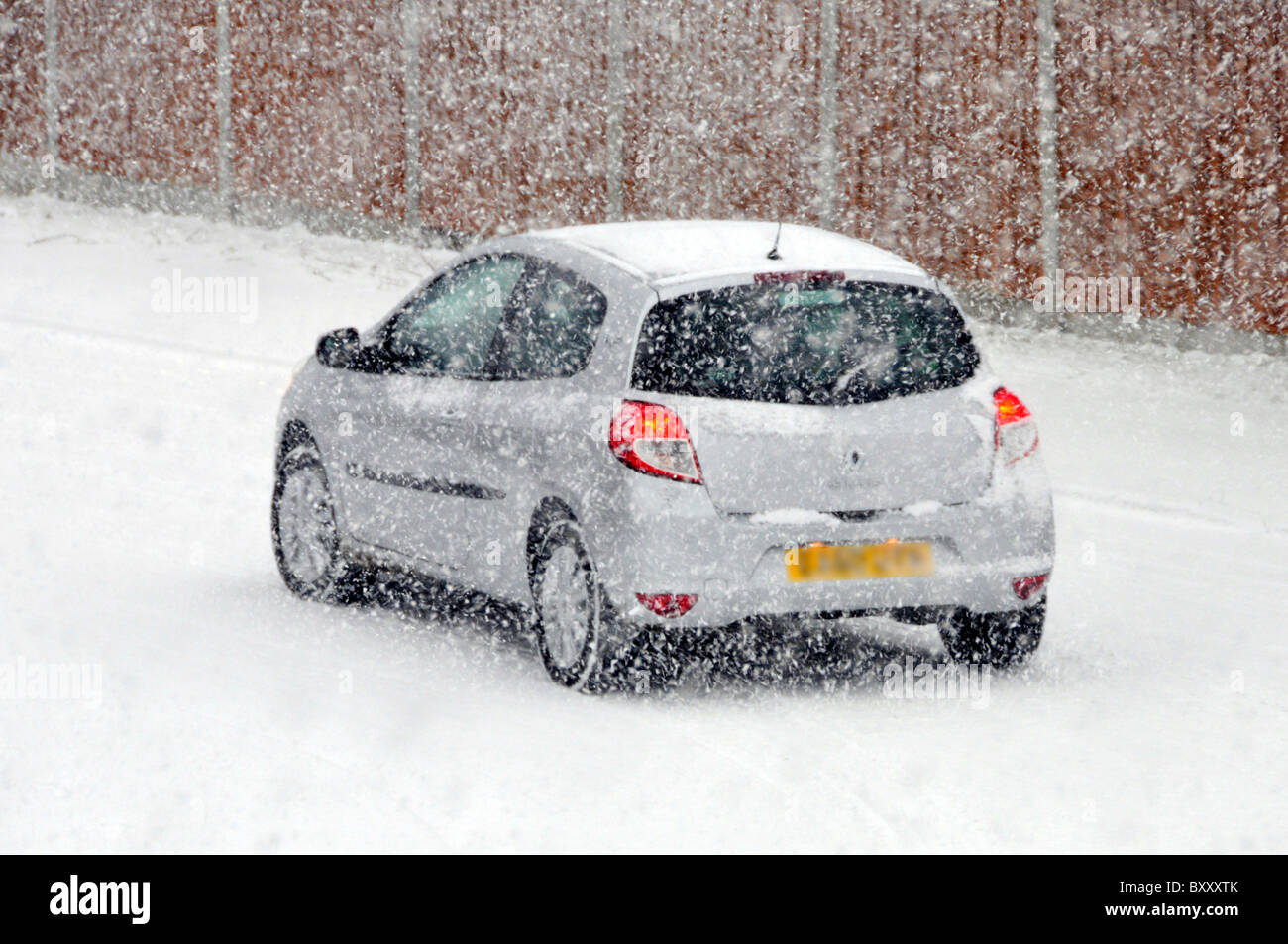 Driving car in snow blizzard Stock Photo - Alamy