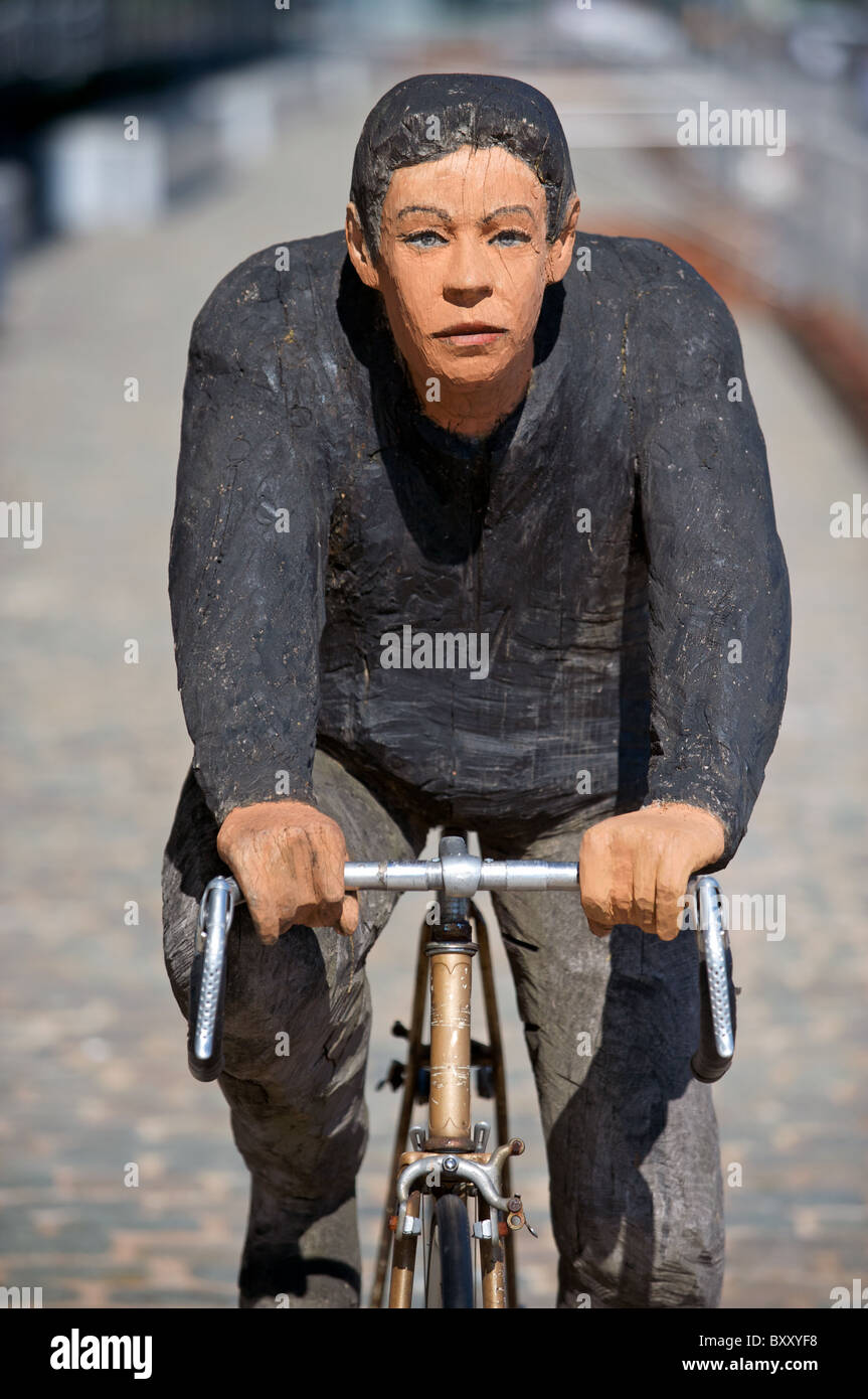 Life-sized model of man riding a bicycle Stock Photo - Alamy