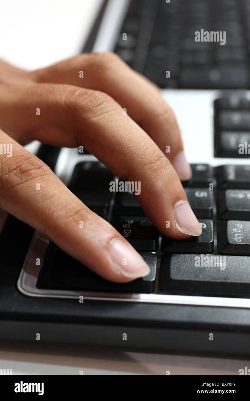 Male hand on computer keyboard Stock Photo - Alamy