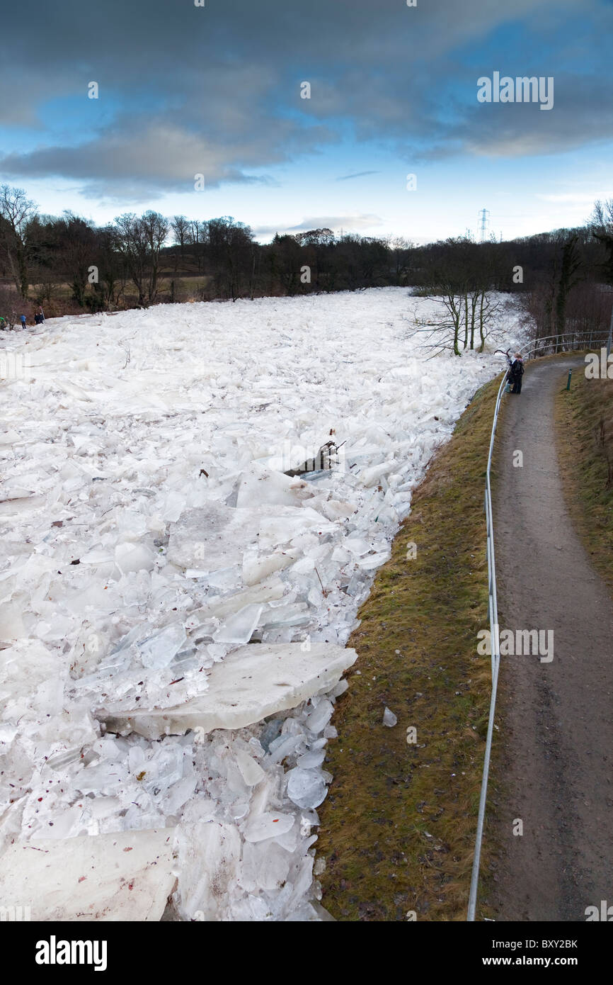 River Ayr frozen over and the ice breaking up into slabs and piling up ...