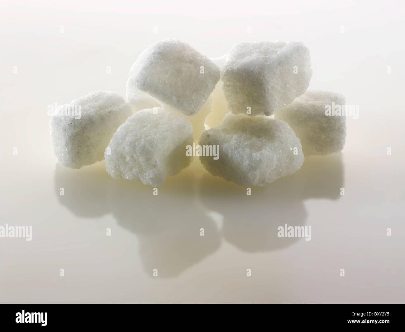 Rough cut white sugar cubes Stock Photo - Alamy