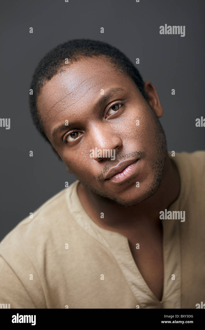 Colour studio portrait of a young African man Stock Photo - Alamy