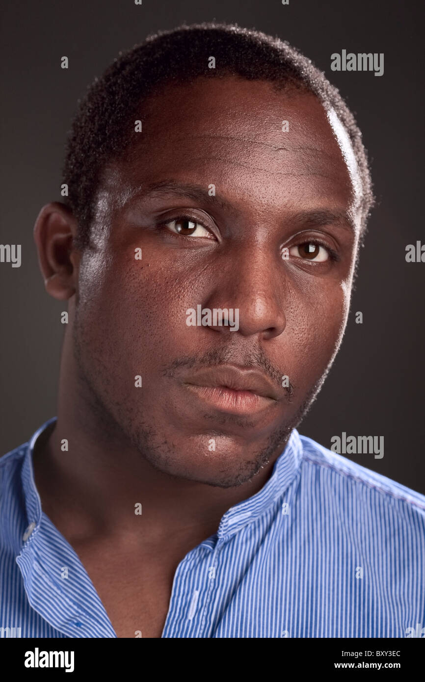 Colour studio portrait of a young African man Stock Photo - Alamy