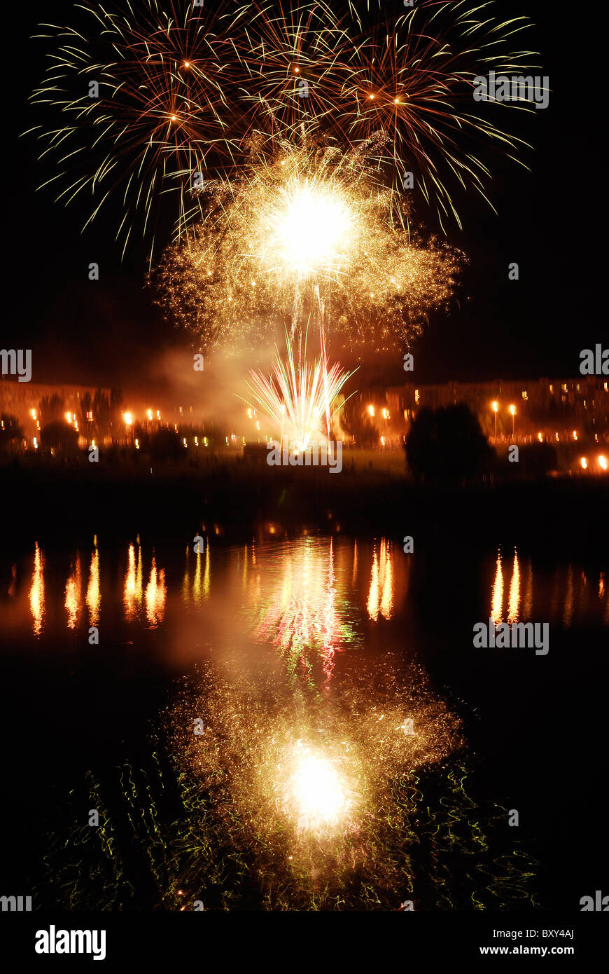 night traditional firework with reflection in water Stock Photo - Alamy