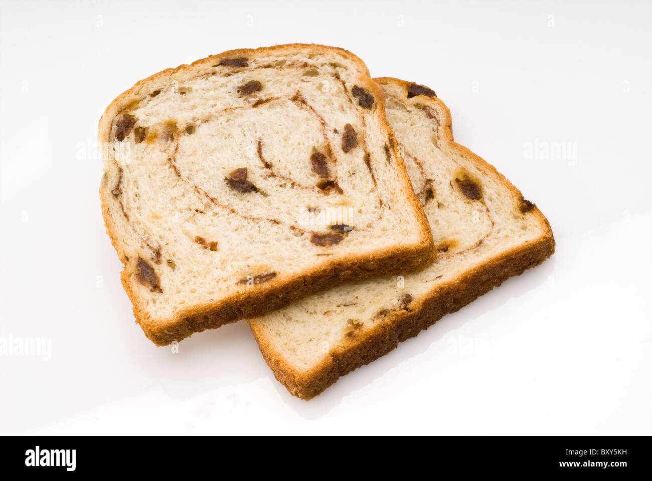 two slices of cinnamon raisin bread isolated on a white background with ...