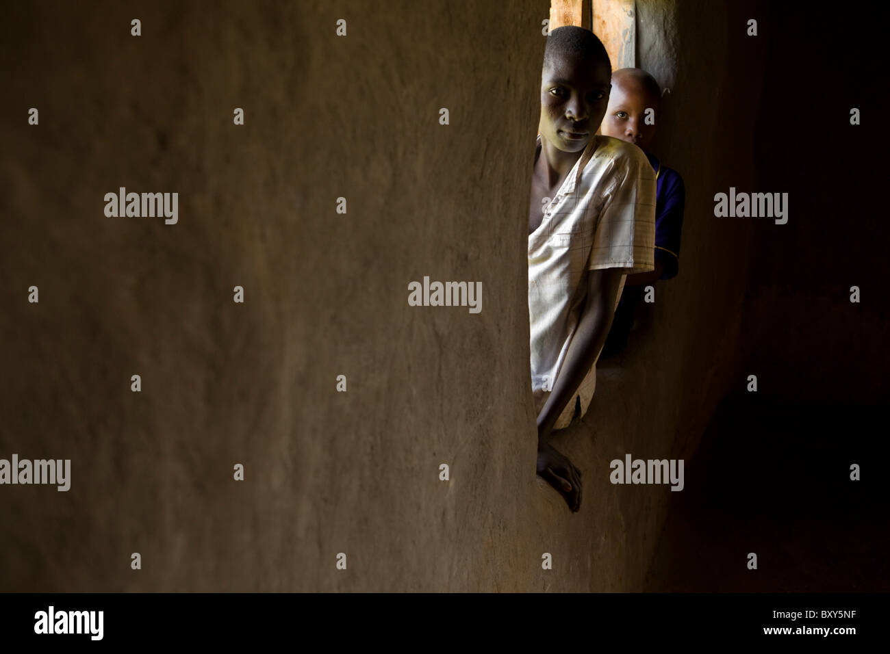 Children peer through a church window in Webuye, Kenya, East Africa ...