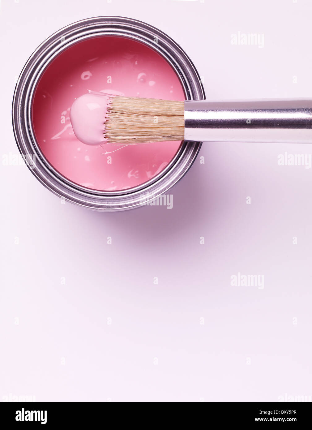 pink paint pot with paint on a brush Stock Photo - Alamy