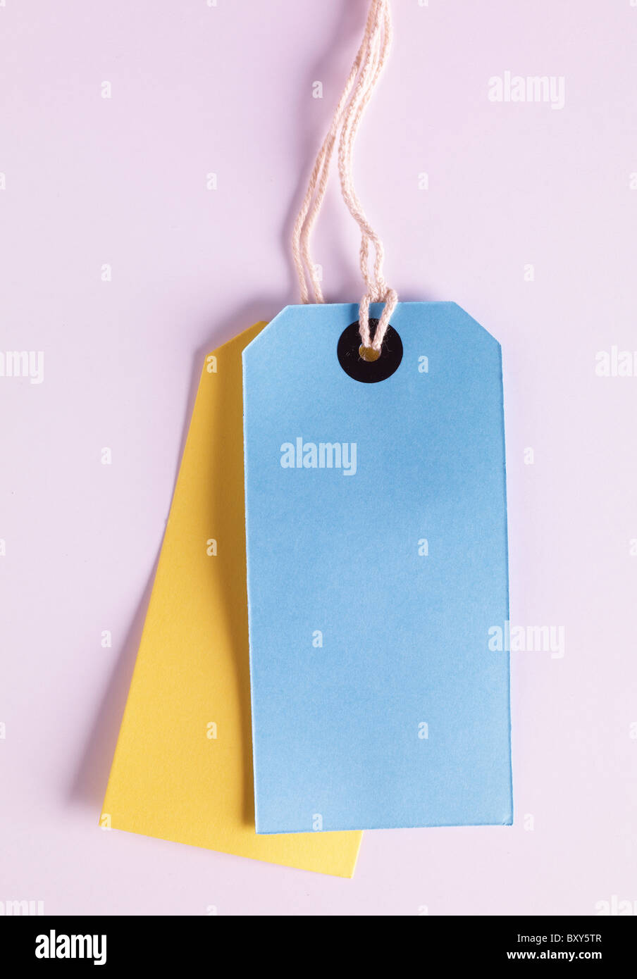blue and yellow luggage tag with red string label string paper Stock ...