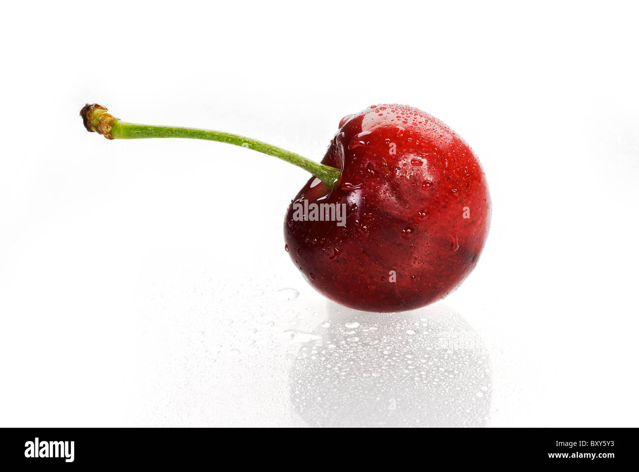 Red cherry with stem isolated on white background Stock Photo - Alamy