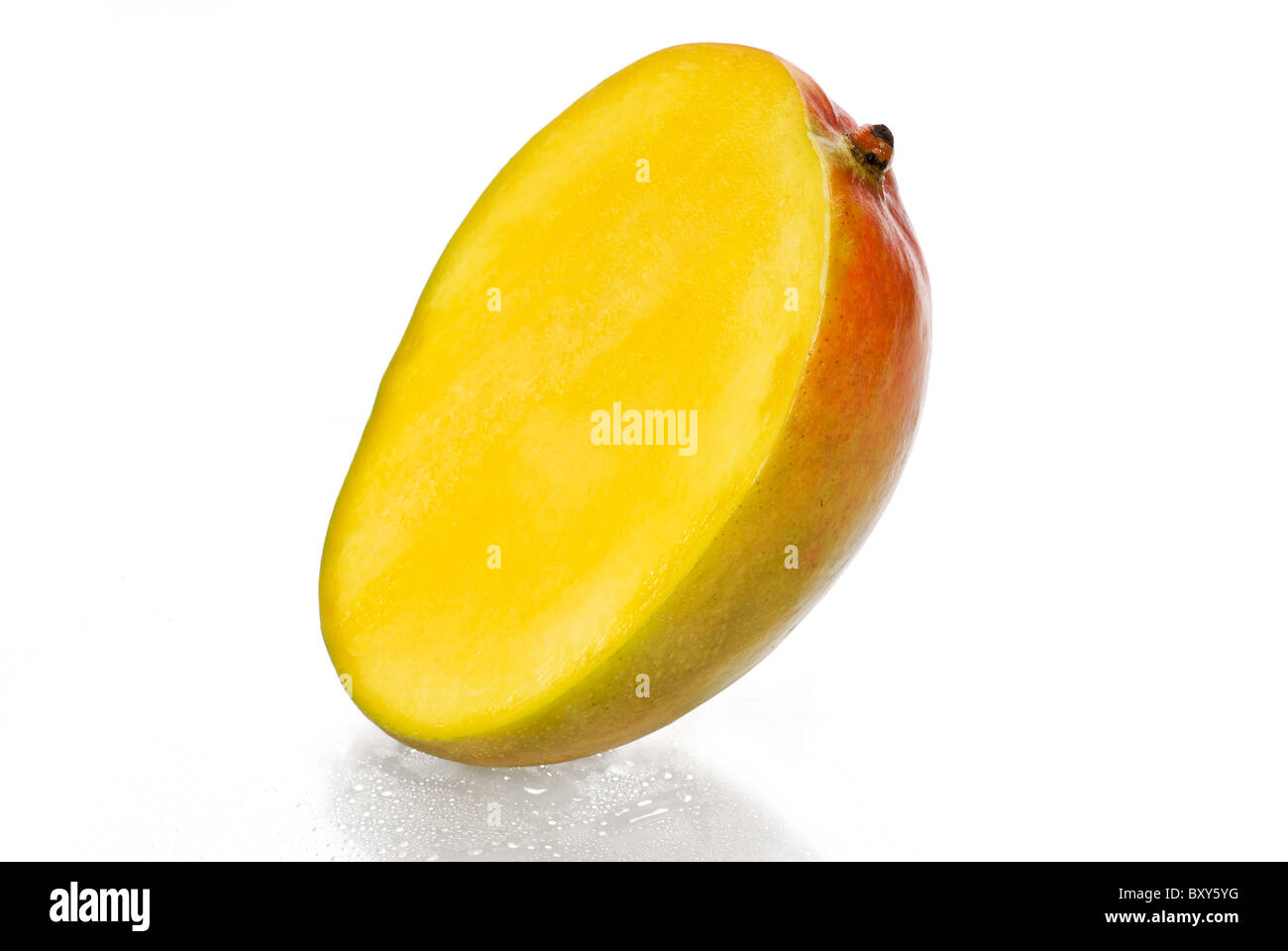 Half mango isolated on white background with clipping path Stock Photo ...