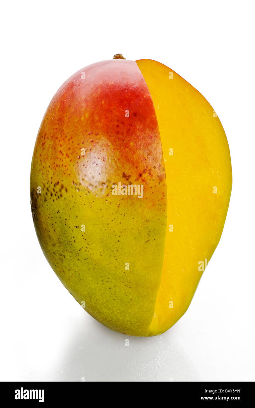 Mango with slice removed Stock Photo - Alamy