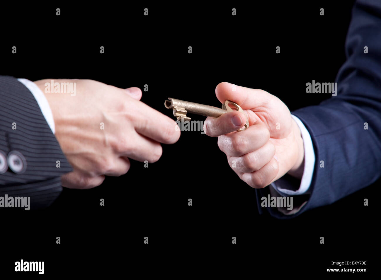 Hand offering you the key Stock Photo - Alamy