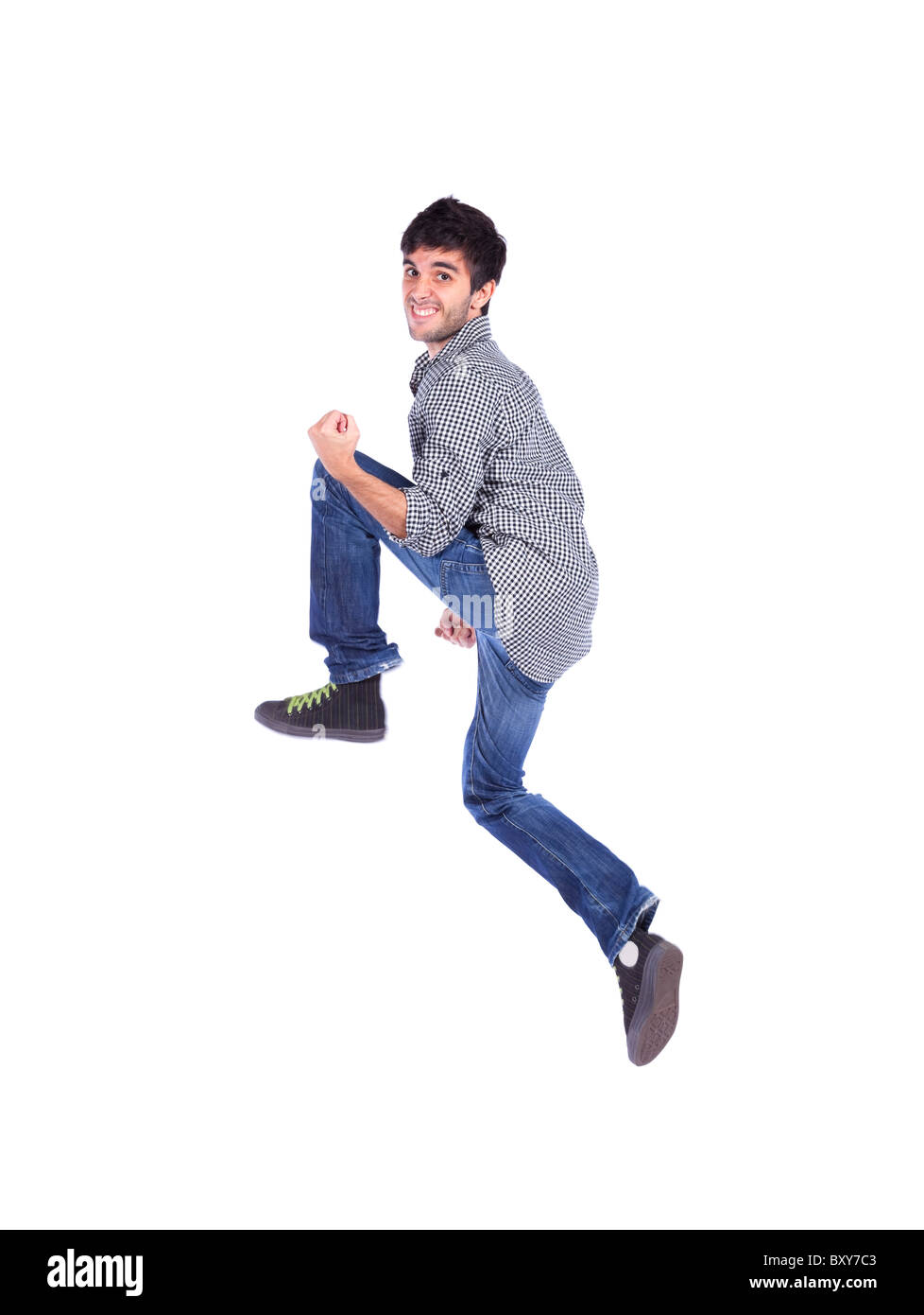 Young man jumping isolated on white (some motion blur Stock Photo - Alamy