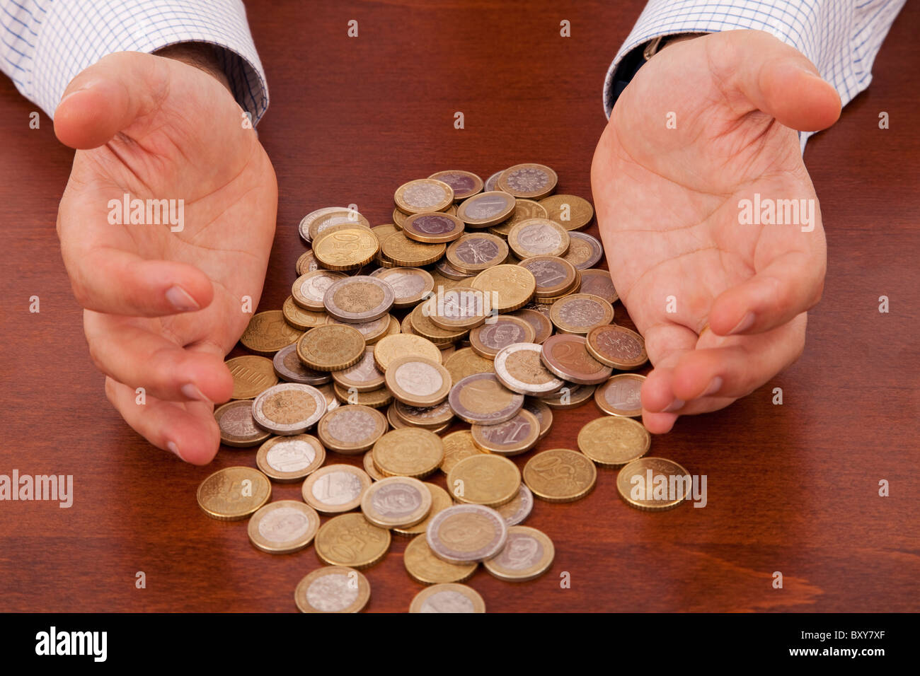 Hands protecting your money Stock Photo - Alamy