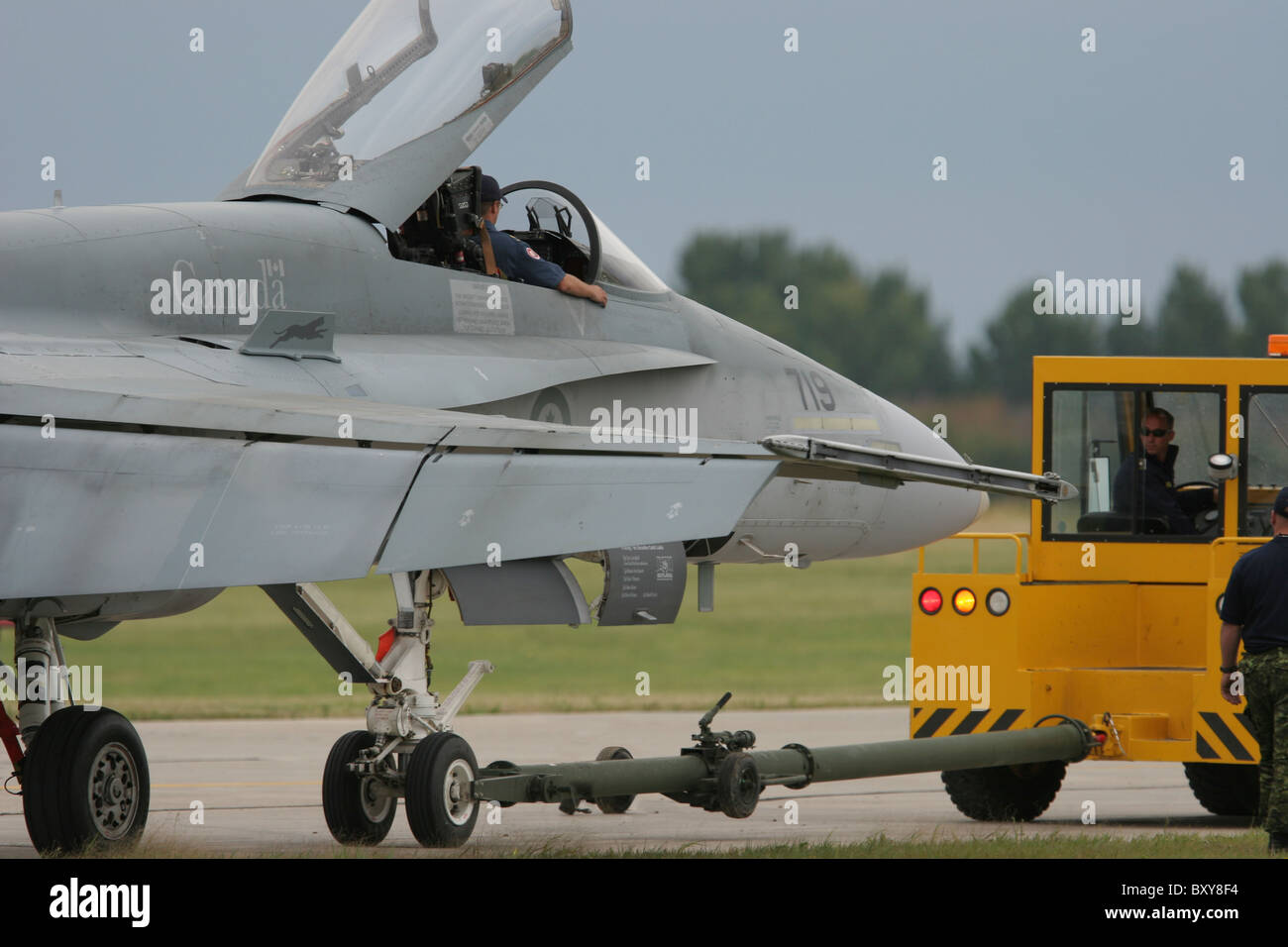 CF-18 being towed by aircraft tug vehicle. John E Diefenbaker ...