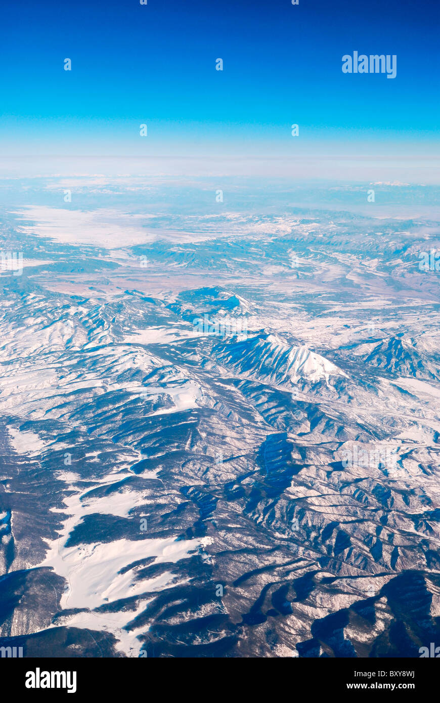 Aerial View of Snowy Mountain. Photo taken from airplane near Phoenix ...