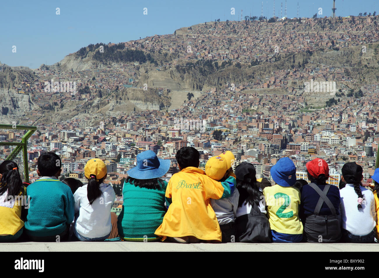 A row of school children looking out across La Paz in Bolivia Stock ...