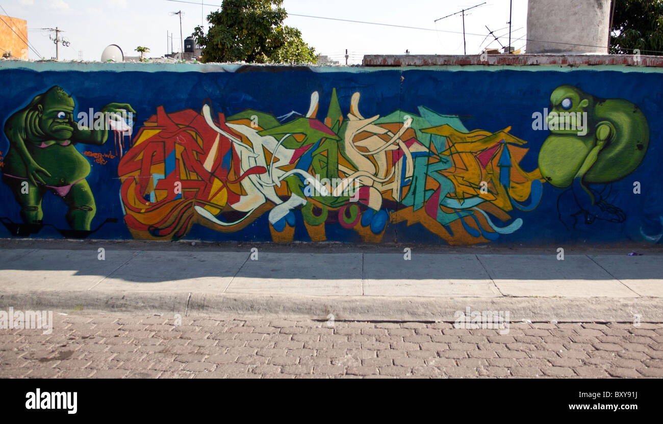 Wall mural depicting green monsters along a street in the Spanish ...