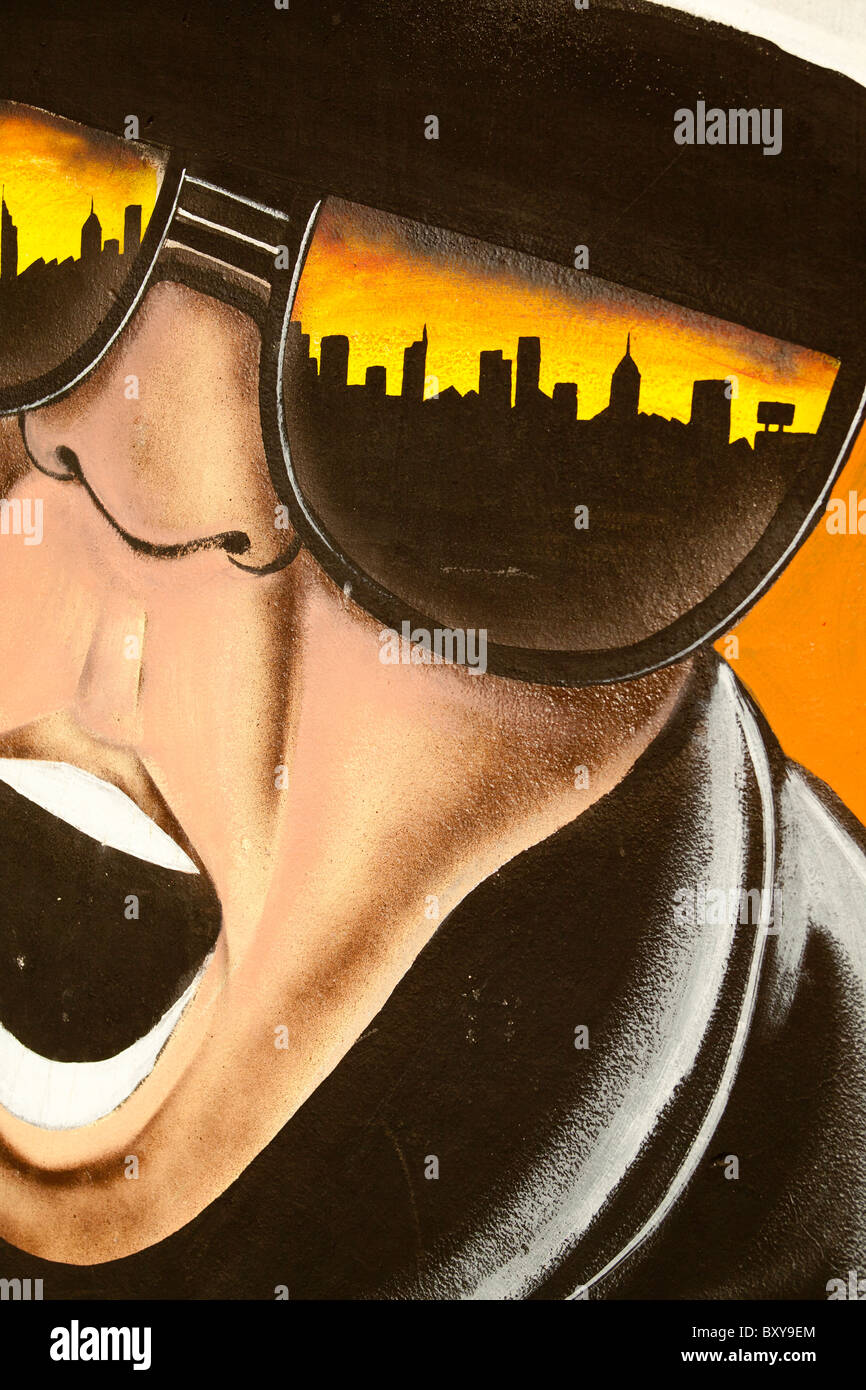 Wall mural depicting an angry young man along a street in the Spanish ...