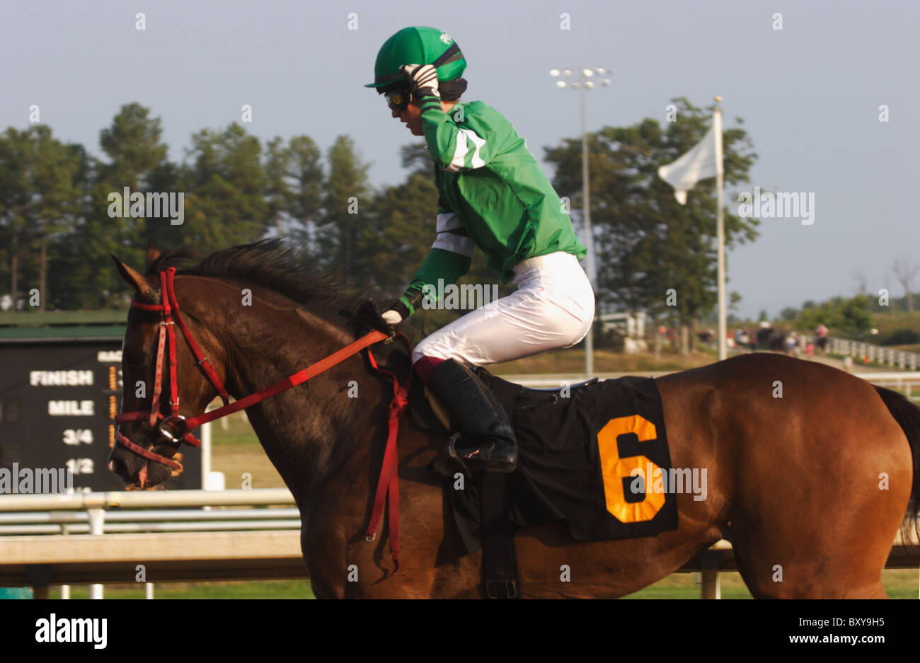 Jockey heading to the starting gate at Colonial downs racetrack in ...