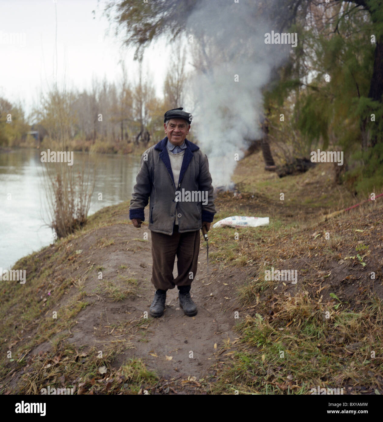 Tending to the fire hi-res stock photography and images - Alamy