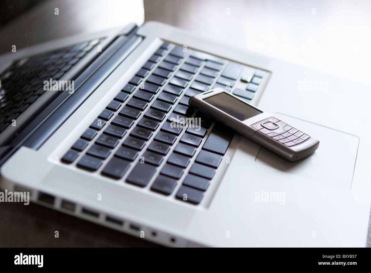 Laptop and mobile phone concept Stock Photo - Alamy