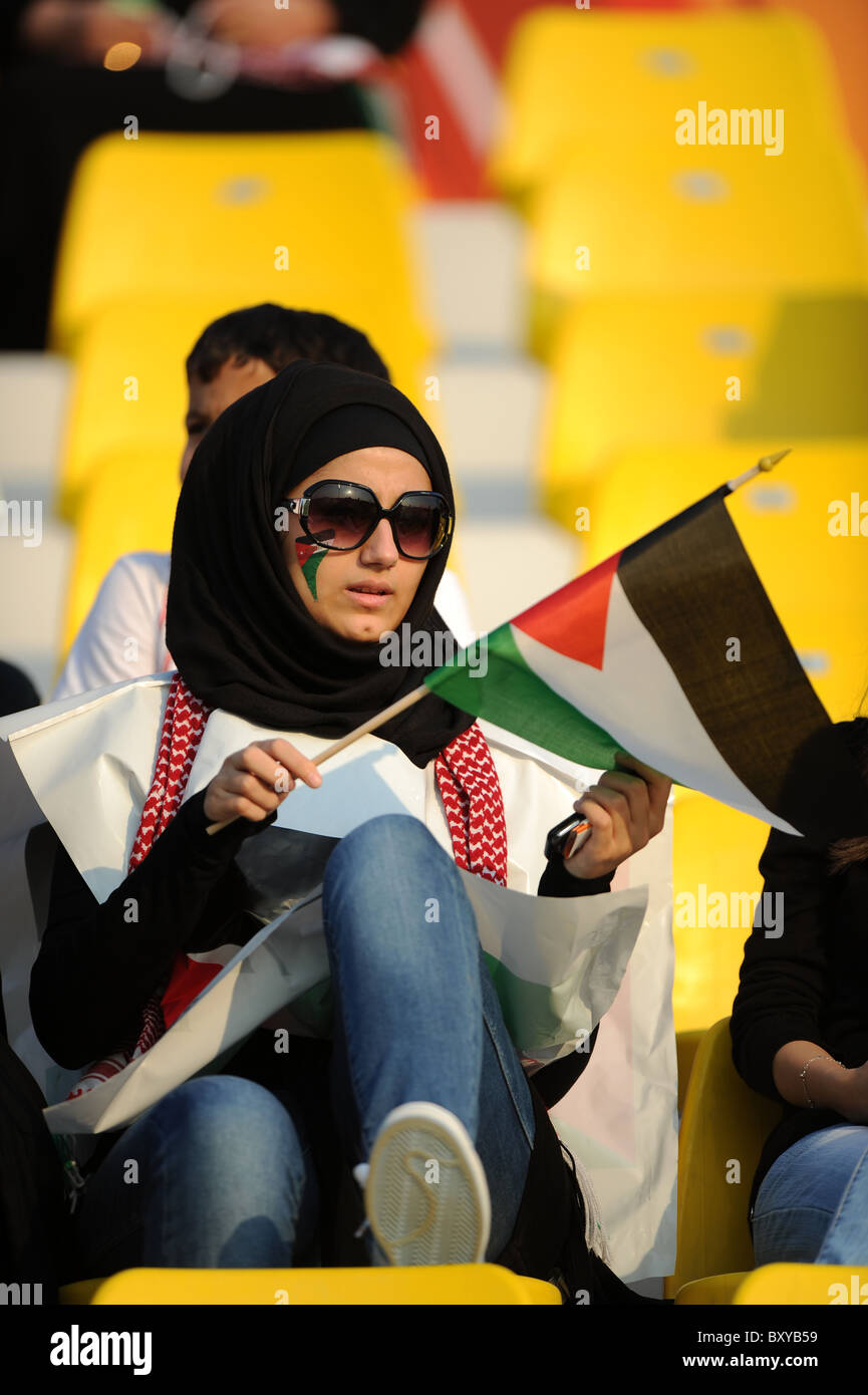 A female football / soccer fan of Jordan holding a national flag Stock ...