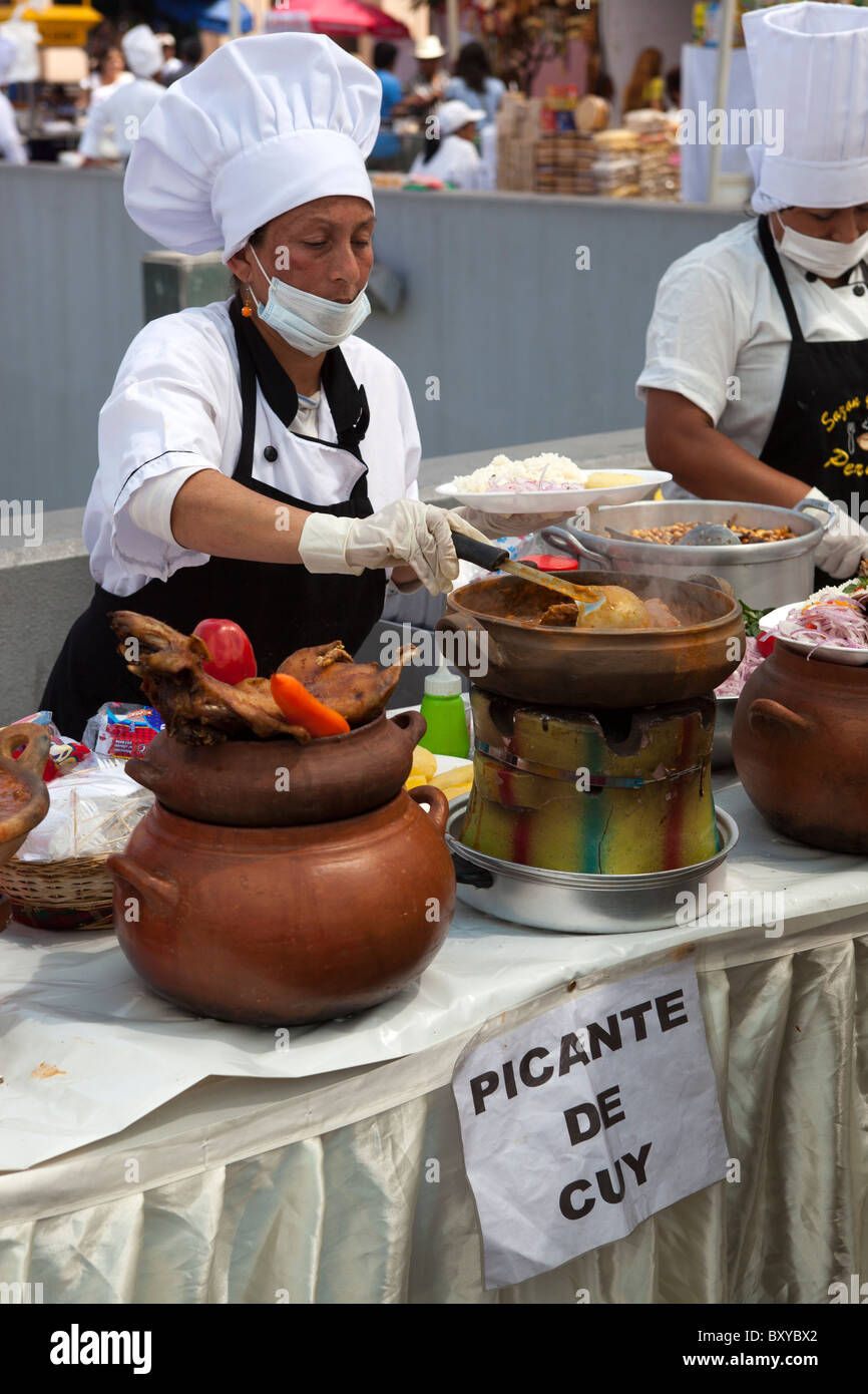 Serving Cooked Guinea Pig or Cuy at Market Stall Lima Peru - An example ...