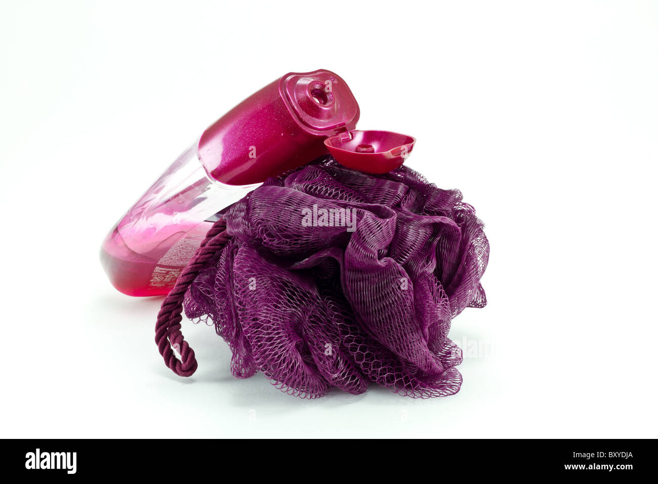 Purple bath sponge and shower gel Stock Photo - Alamy
