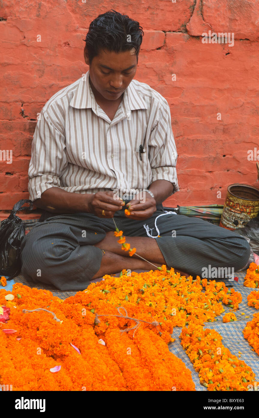 marigold garland seller at the temple in Durbar Square in Kathmandu ...