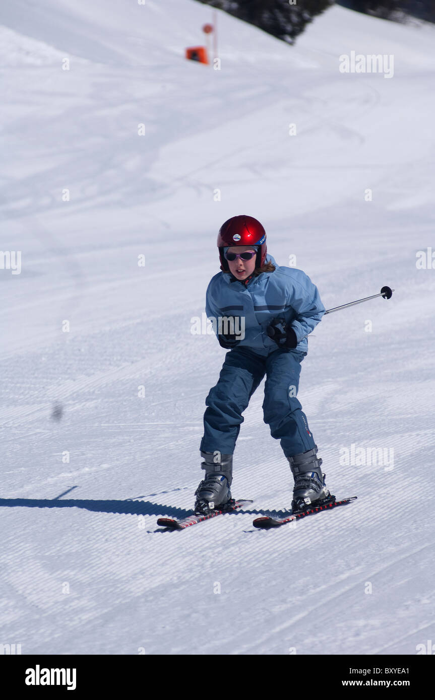young girl skiing on a blue run Stock Photo - Alamy