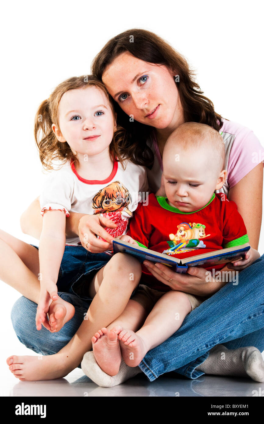Mother reading to her children isolated on white Stock Photo - Alamy