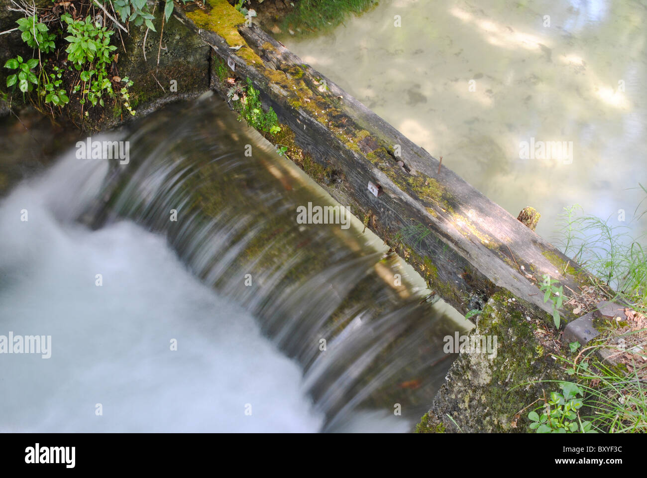 cascade dam artificial wood used as a barrier to the drainage ditch ...