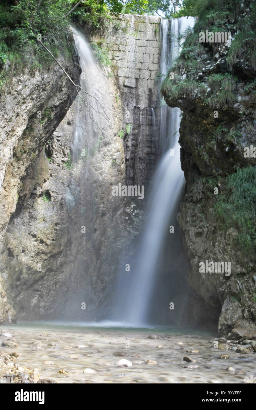 cascade of pure fresh water falling from the steep rocks Stock Photo ...