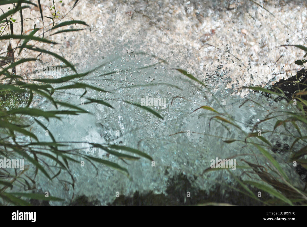 pure and sparkling waterfall falling over rocks Stock Photo - Alamy
