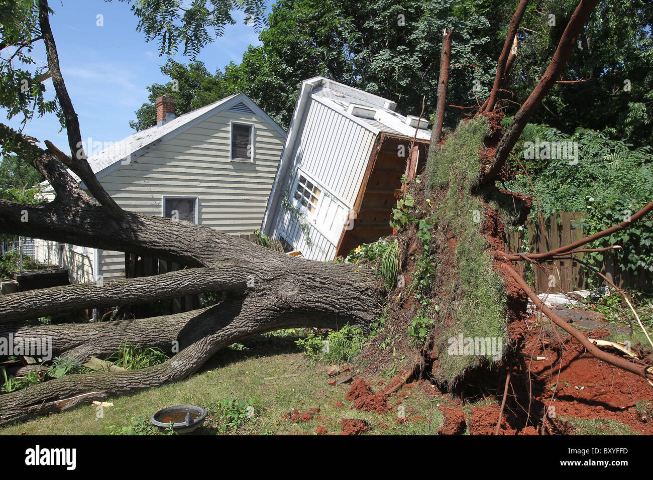 A tree destroys the side of a home during a storm in Charlottesville ...
